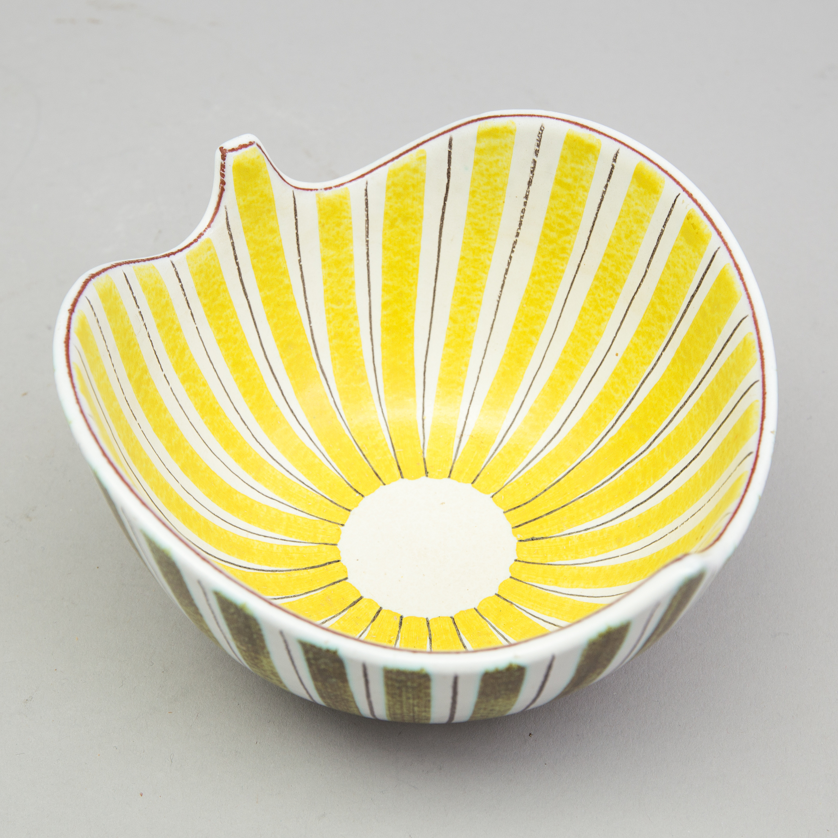 A stoneware bowl designed by Stig Lindberg, signed and numbered for ...