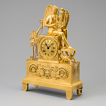 An early 19th century empire gilt bronze table clock. - Bukowskis