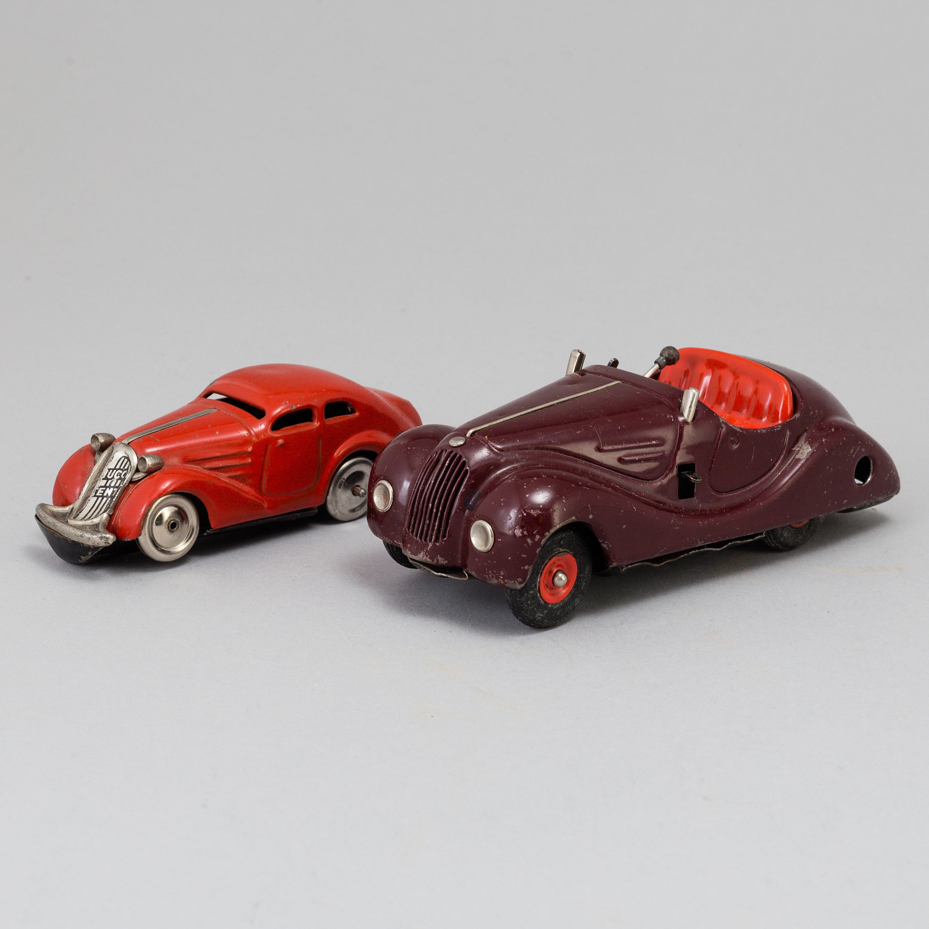 TWO TINPLATE SCHUCO TOY CARS. - Bukowskis