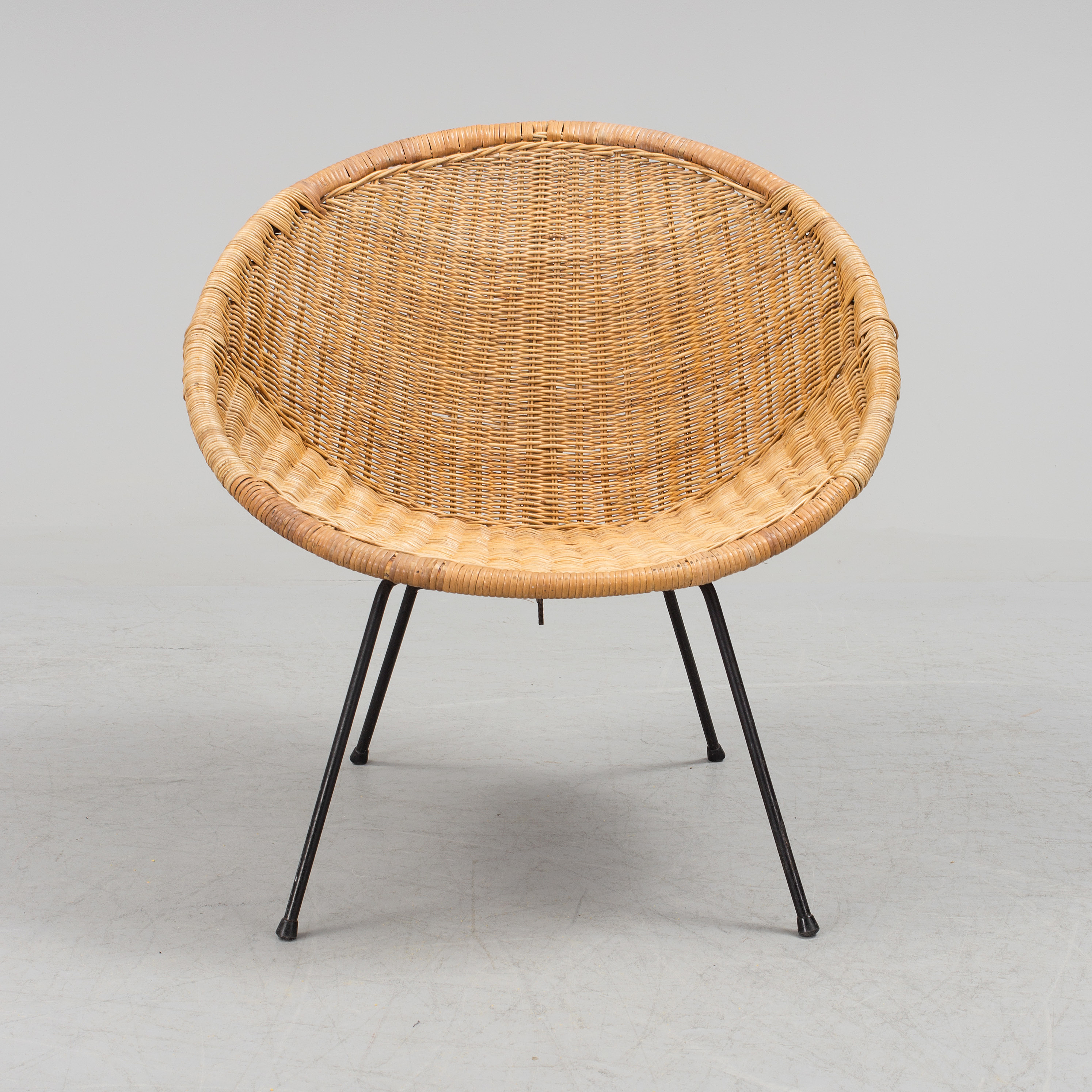A rattan easy chair, 1950's. - Bukowskis