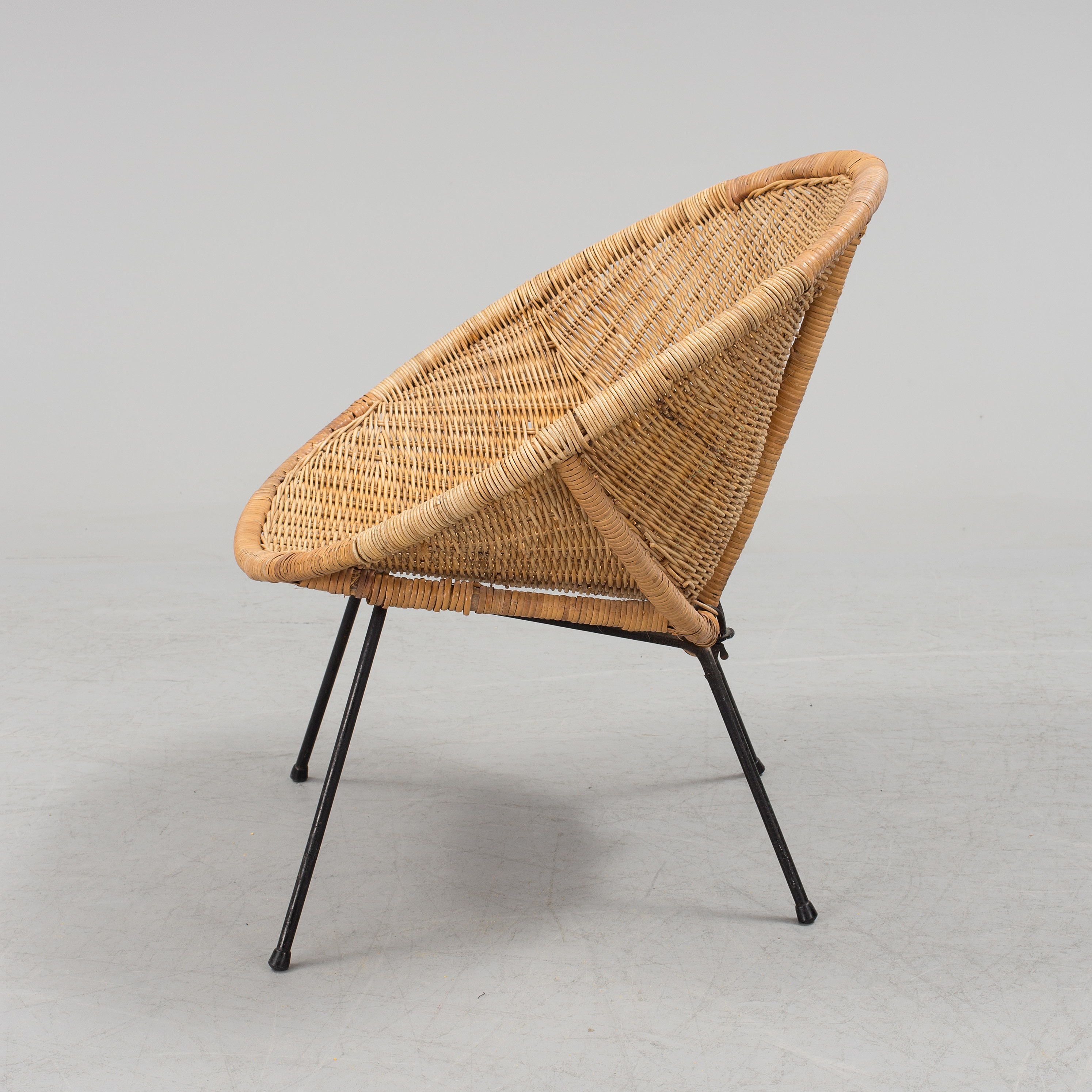 A rattan easy chair, 1950's. - Bukowskis