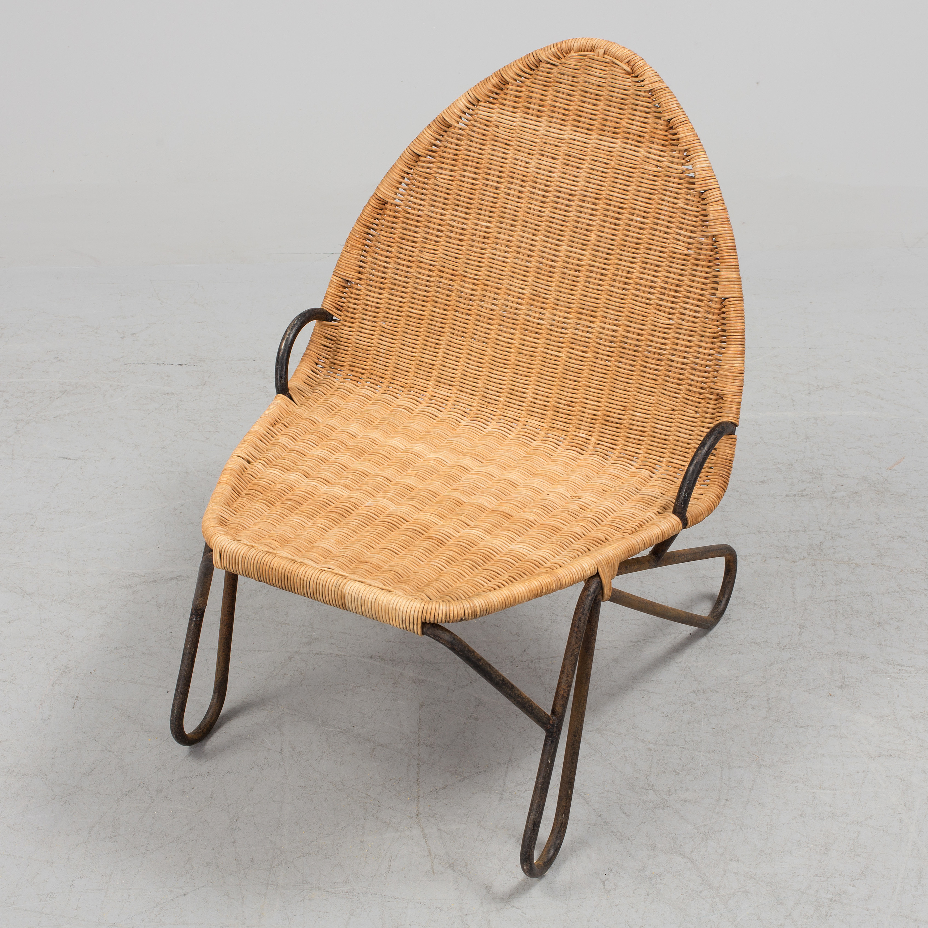 A rattan easy chair, 1950's. - Bukowskis