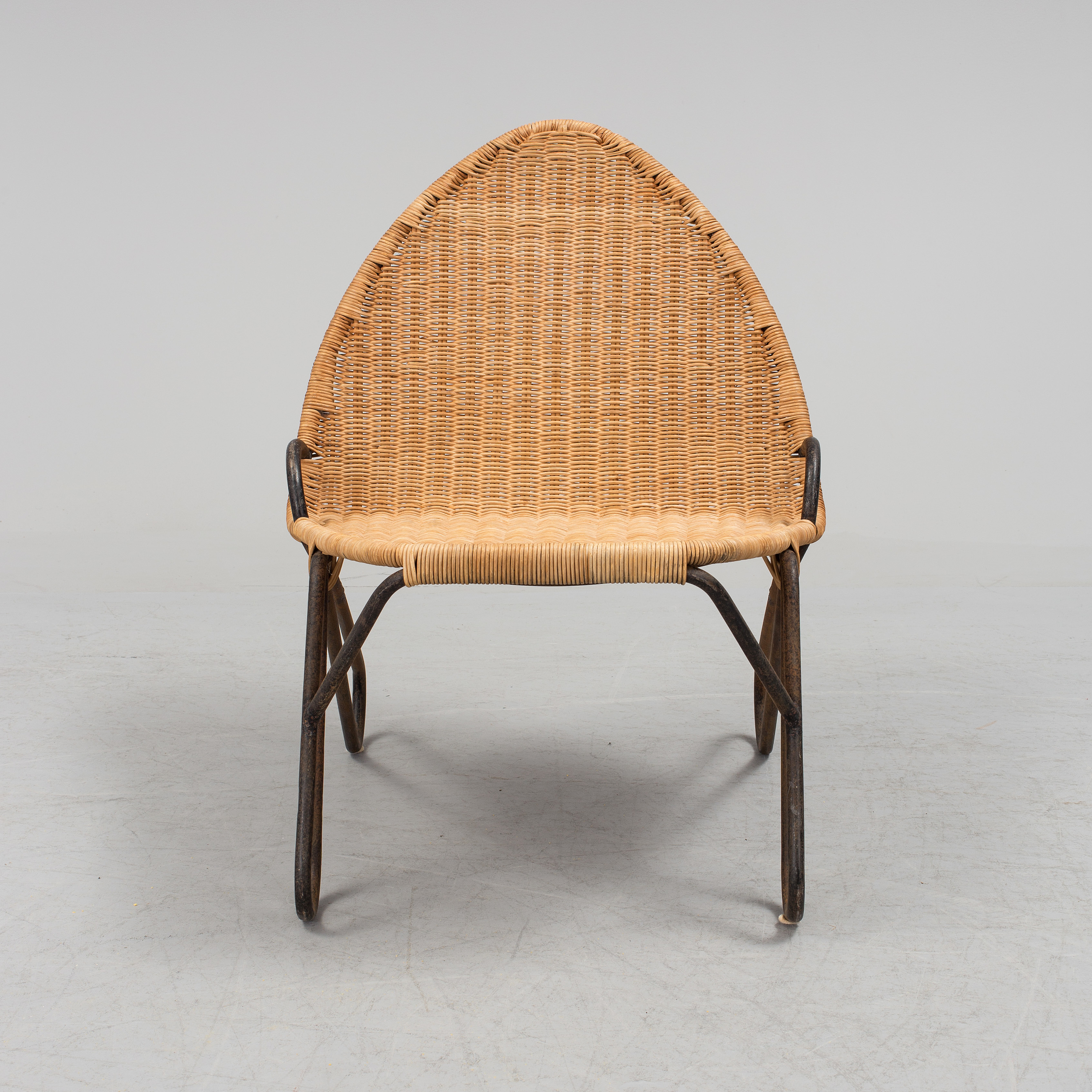 A rattan easy chair, 1950's. - Bukowskis