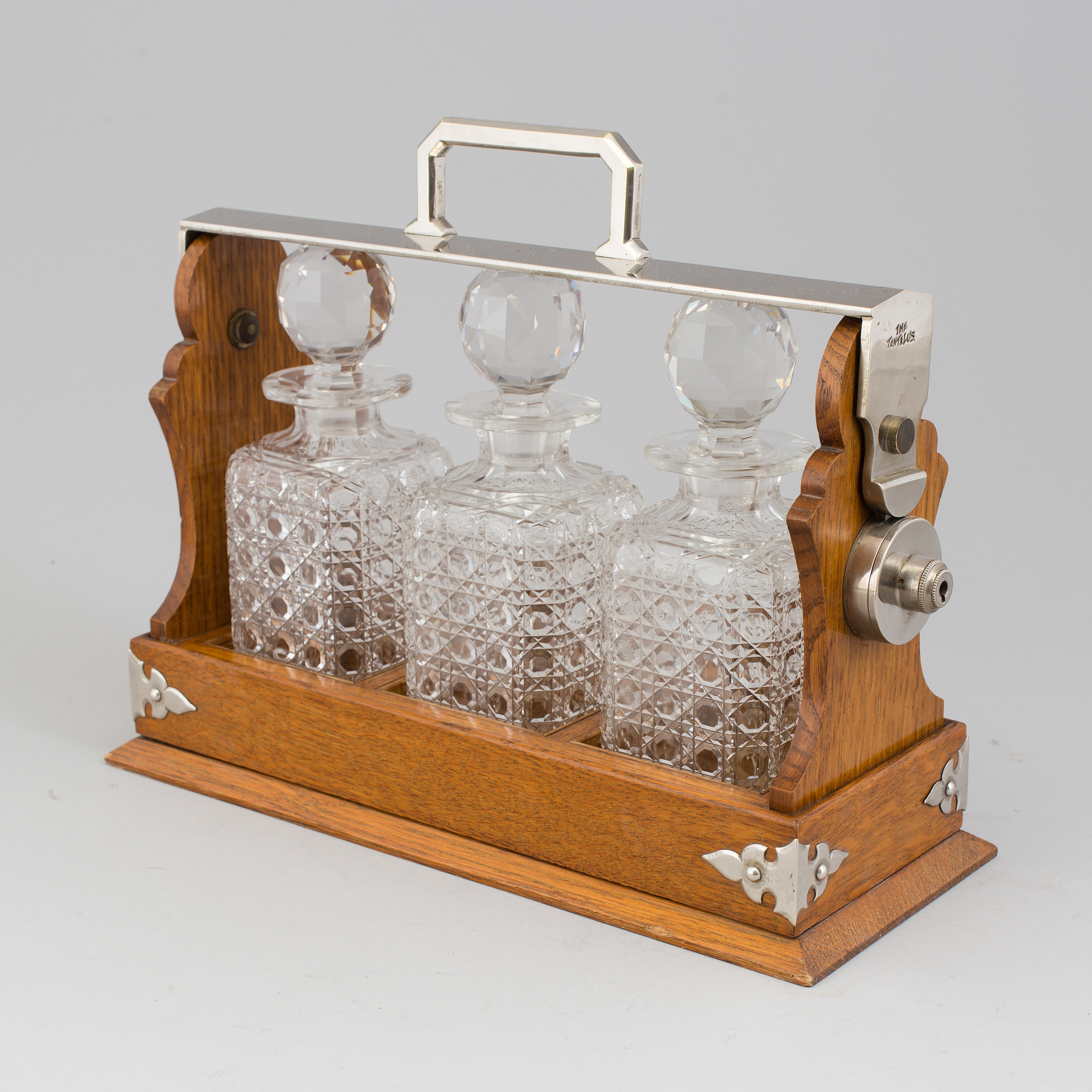 A 20th century tantalus 'The Tantalus'. - Bukowskis