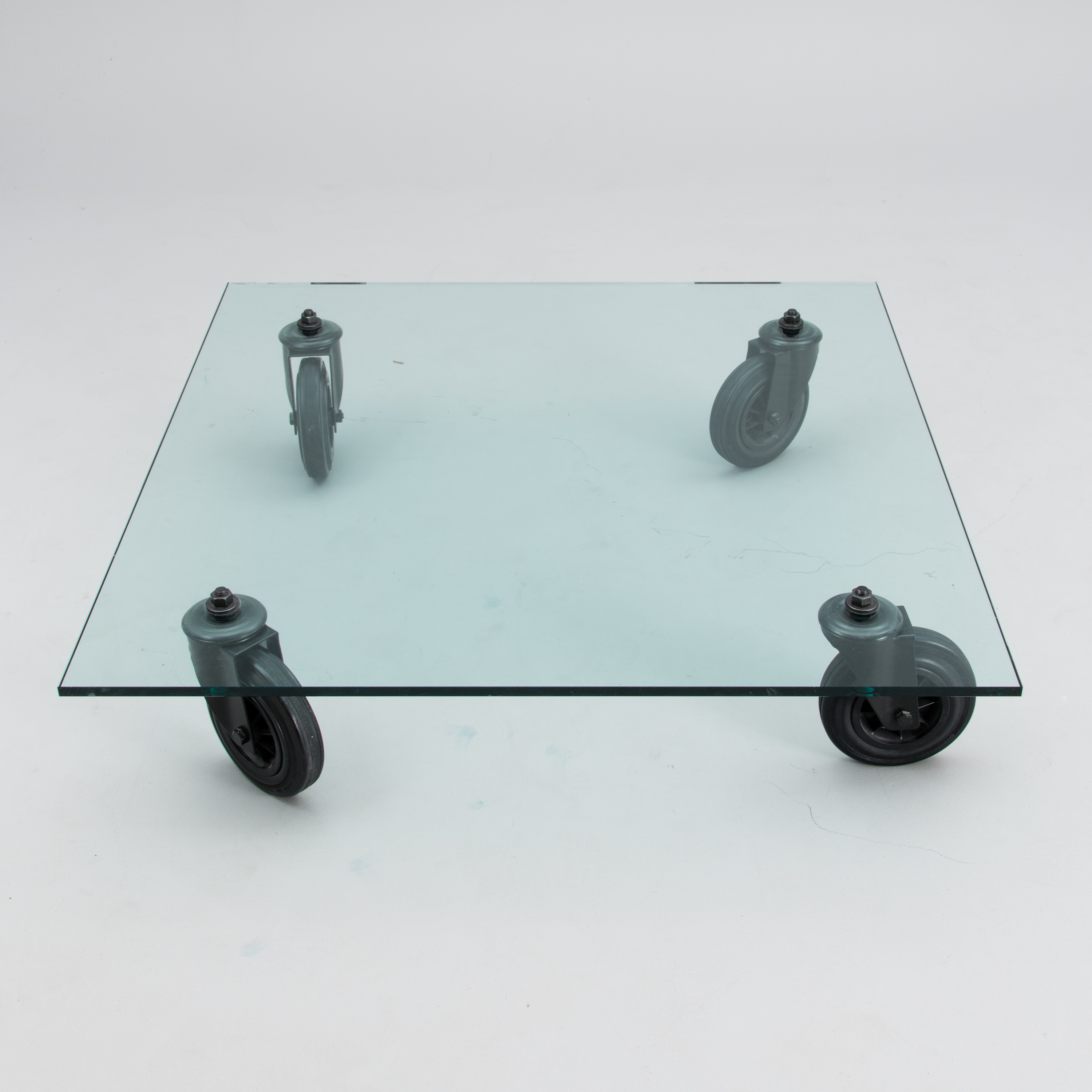 A "Tavolo con Ruote" coffee table by Fontana Arte, designed 1980 ...