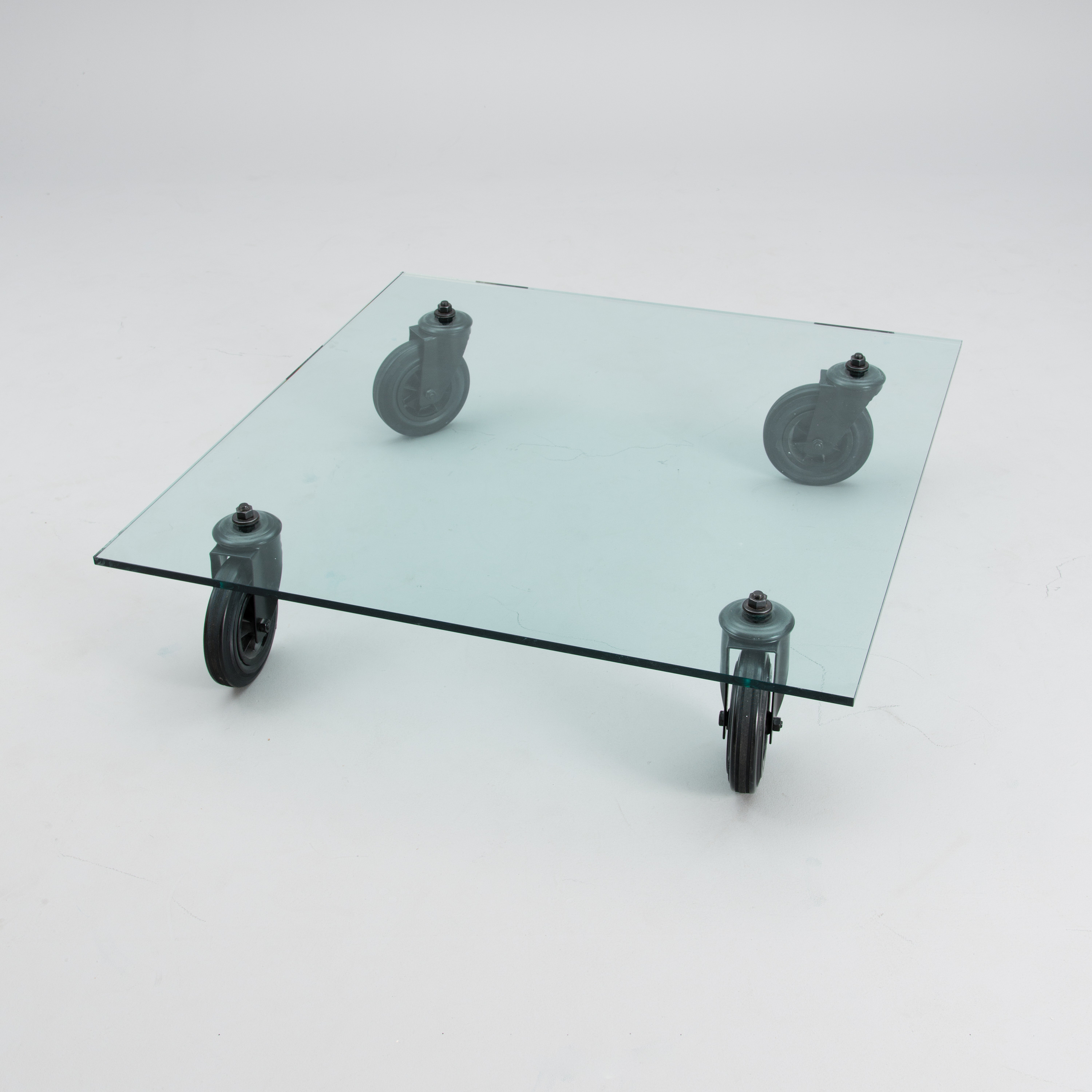 A "Tavolo con Ruote" coffee table by Fontana Arte, designed 1980 ...