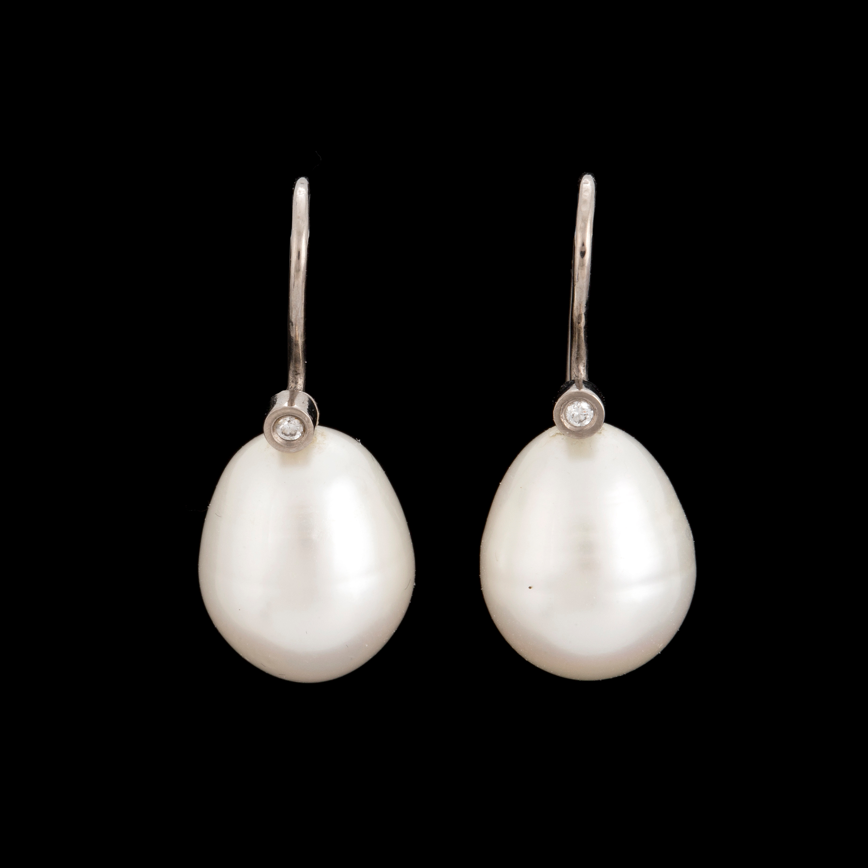 A pair of earrings with pear-shaped, cultured 'South Sea' pearls and ...