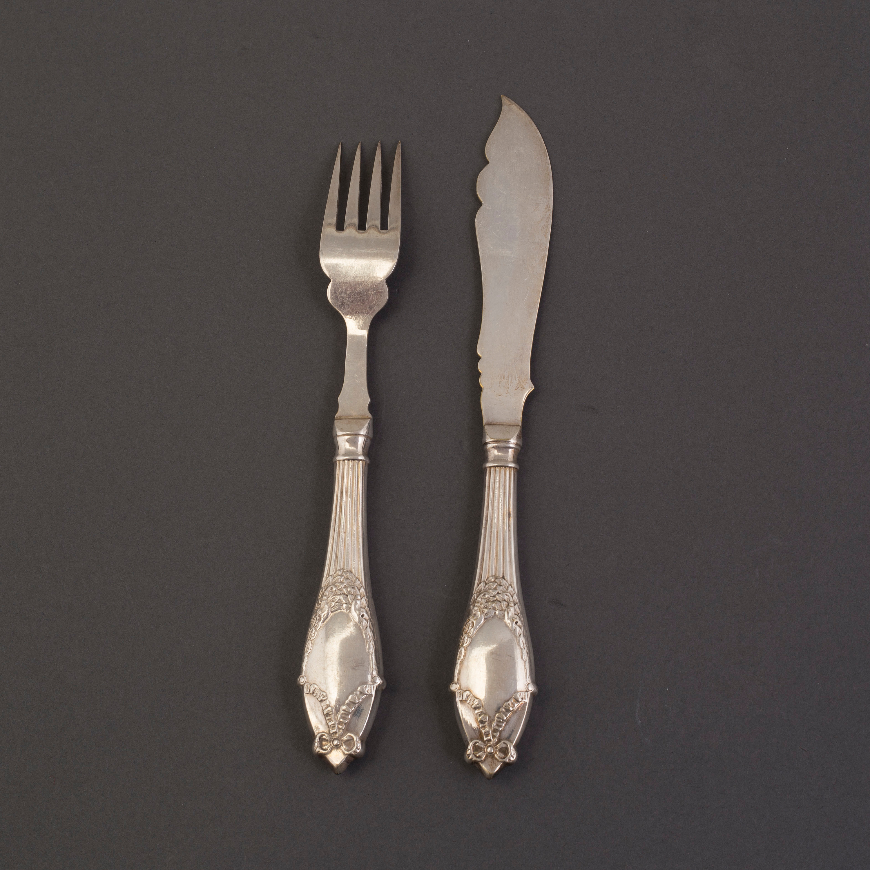 24 PIECES OF SILVER PLATE FISH CUTLERY, early 20th Century. - Bukowskis