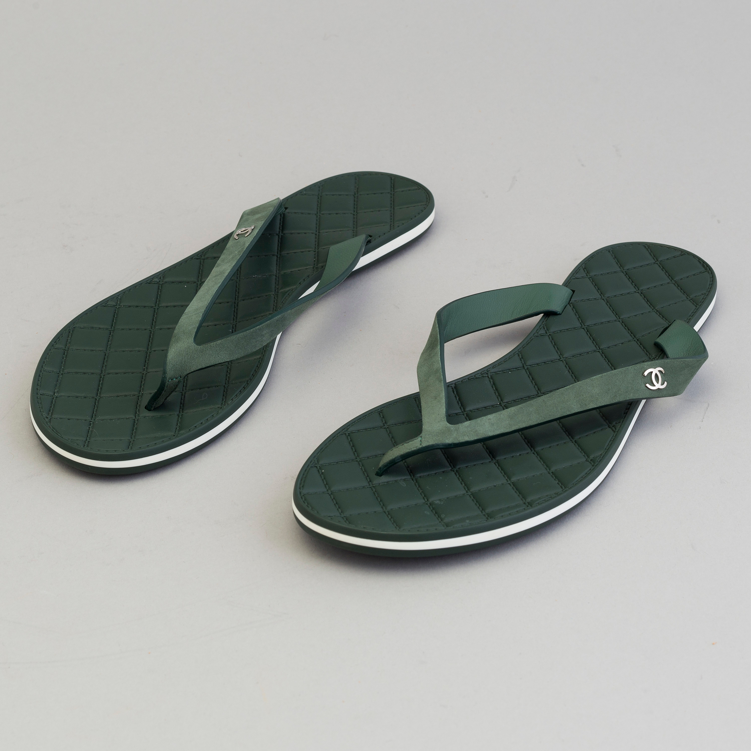 CHANEL, a pair of plastic flip-flop sandals, size 37. - Bukowskis