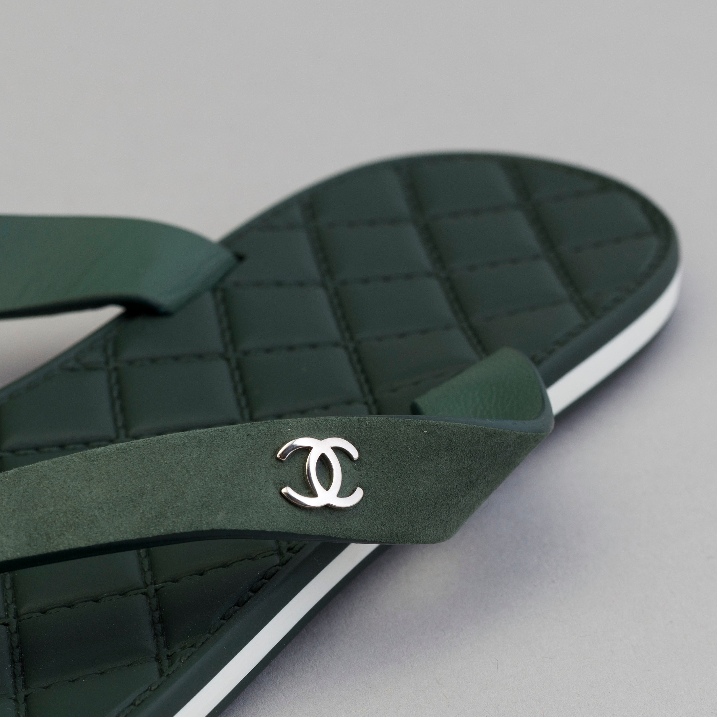 CHANEL, a pair of plastic flip-flop sandals, size 37. - Bukowskis