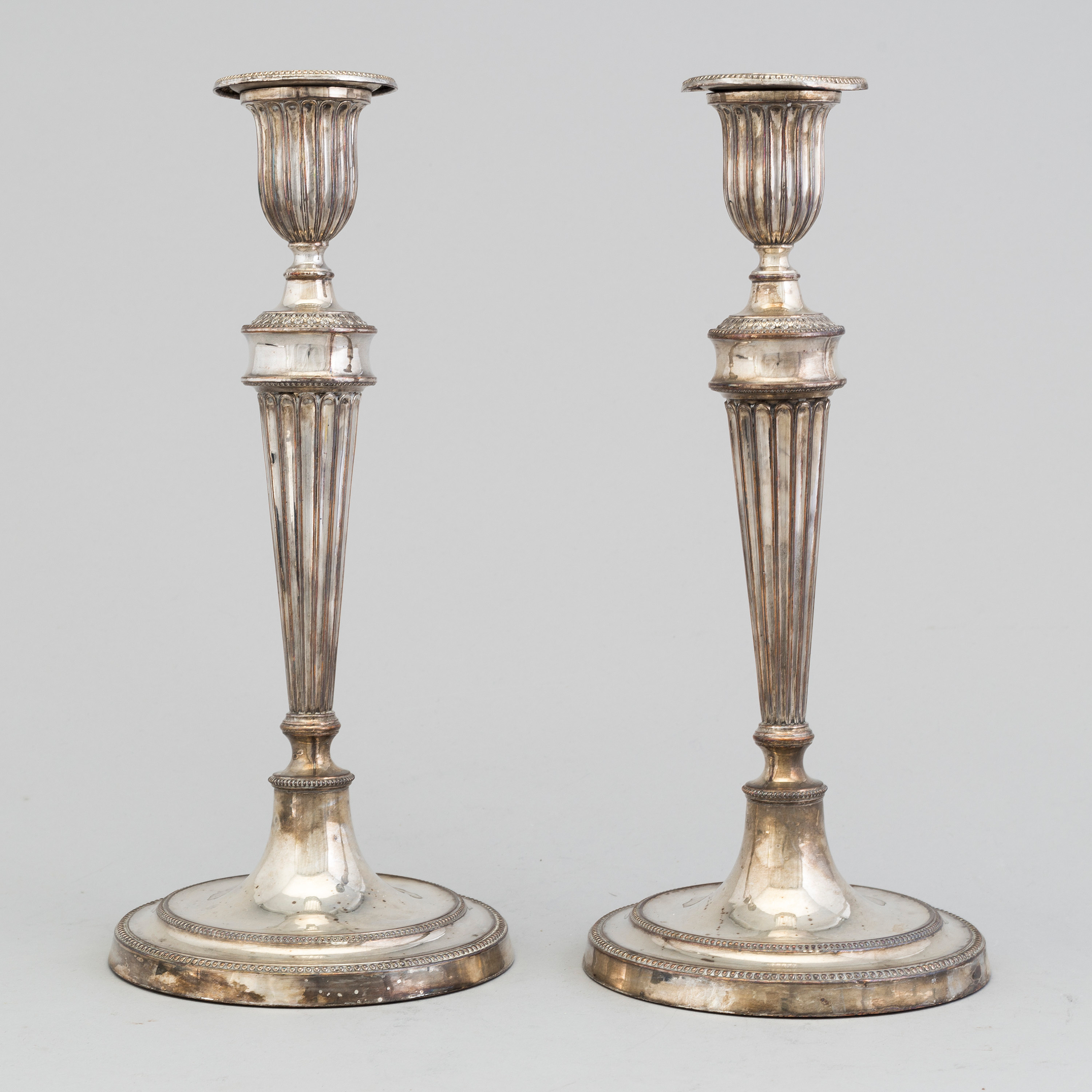 A pair of mid 19th century candlesticks. - Bukowskis