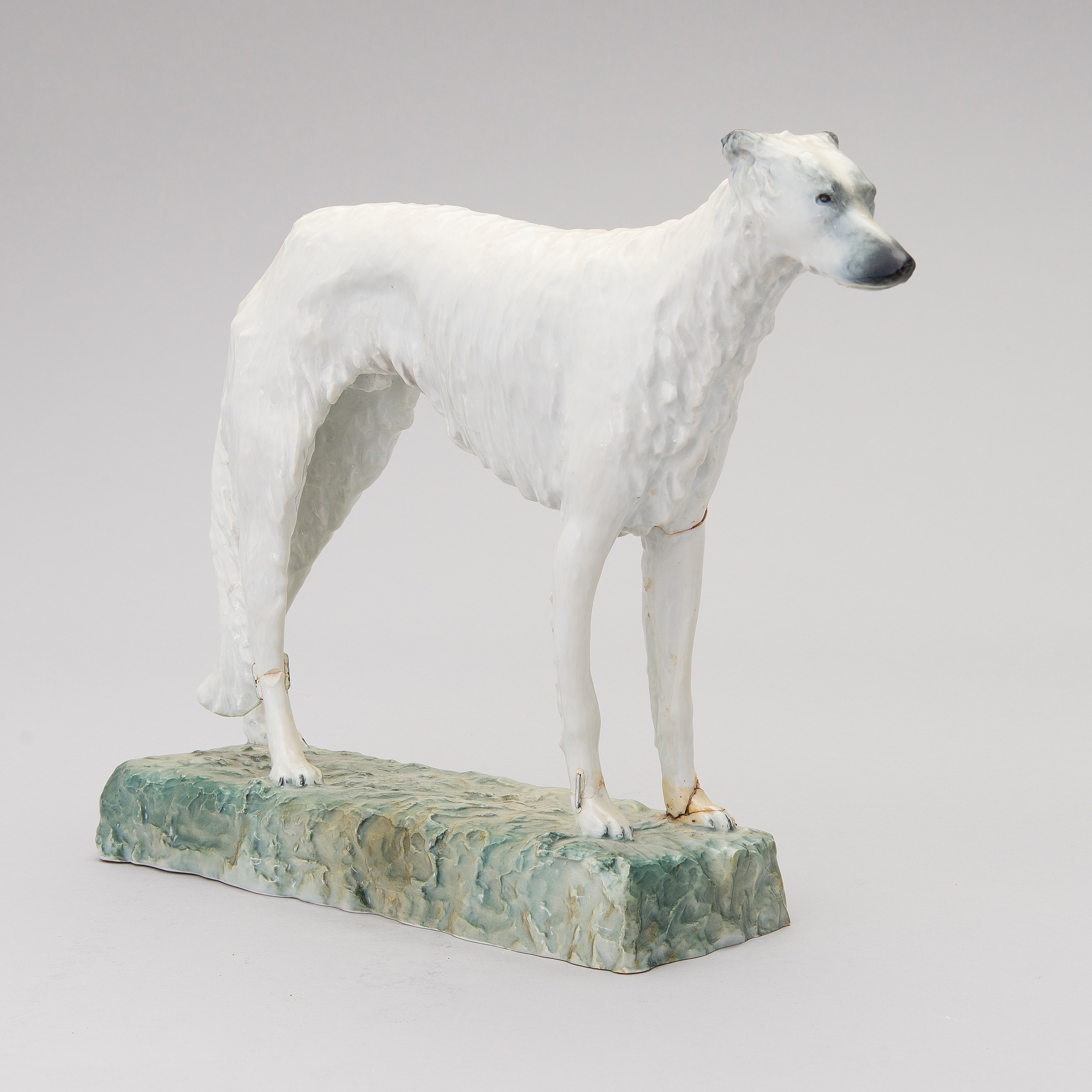A porcelain borzoi figurine from Arabia Finland, signed and dated -30 ...