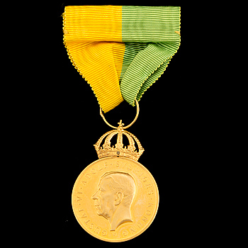 A commemorative Royal Swedish gold medal on yellow and green ribbon ...