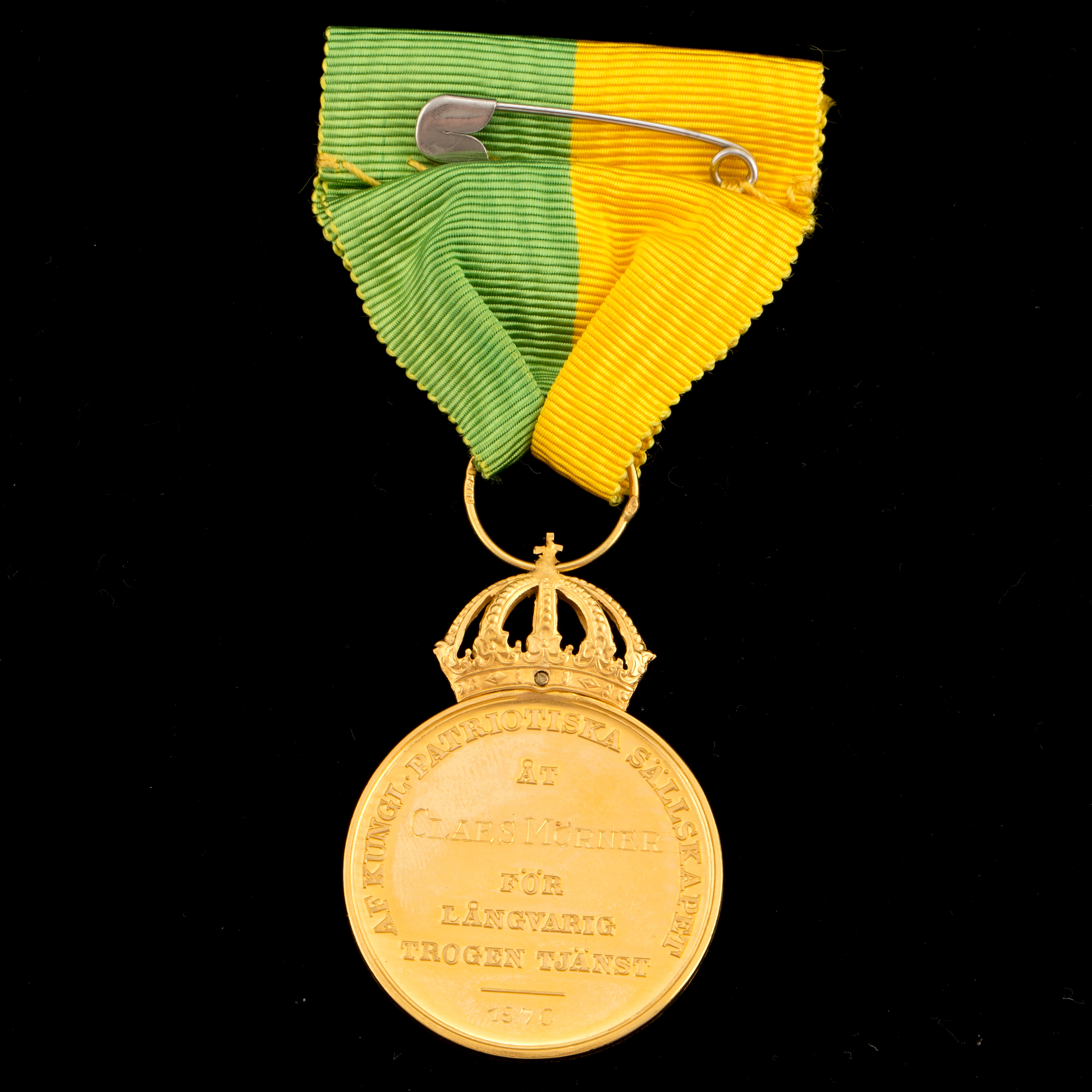 A commemorative Royal Swedish gold medal on yellow and green ribbon ...