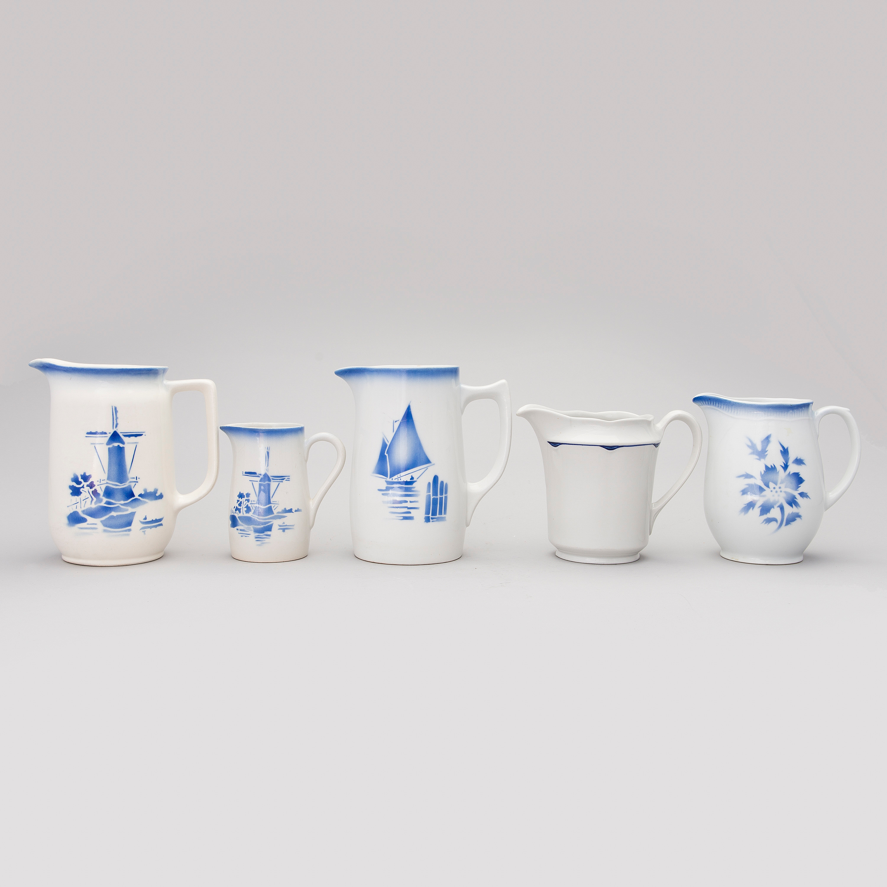 A set of five different ceramic milk jugs by Arabia, Finland 1930s-40s ...