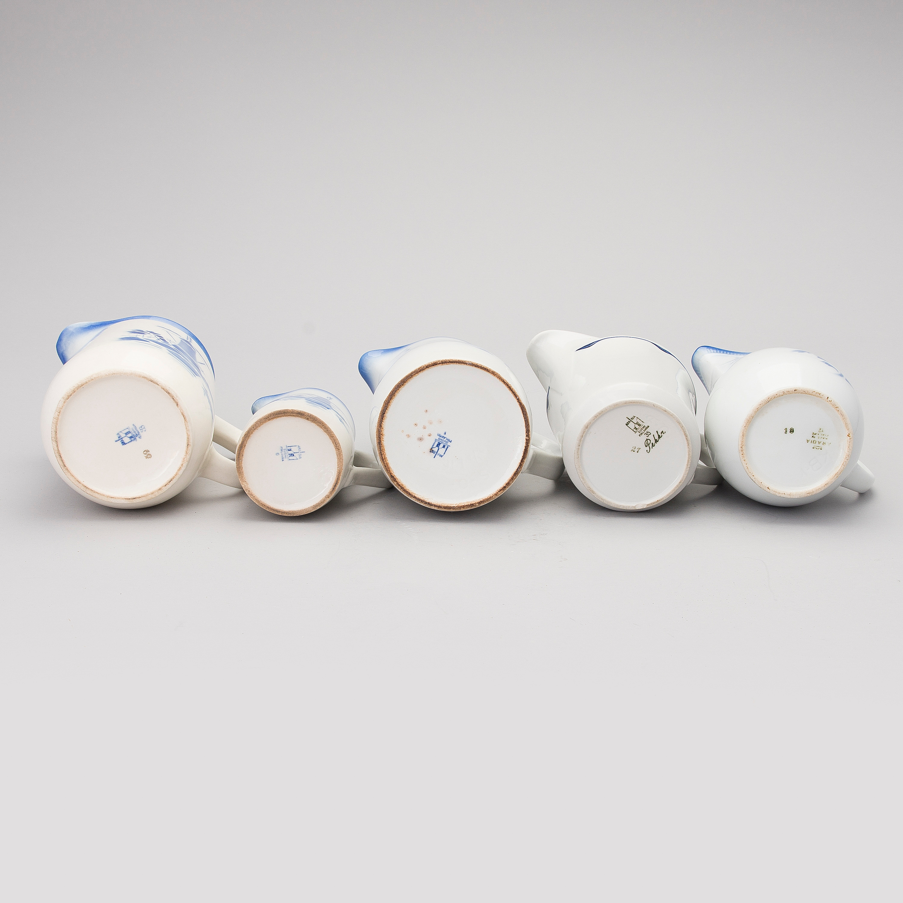 A set of five different ceramic milk jugs by Arabia, Finland 1930s-40s ...