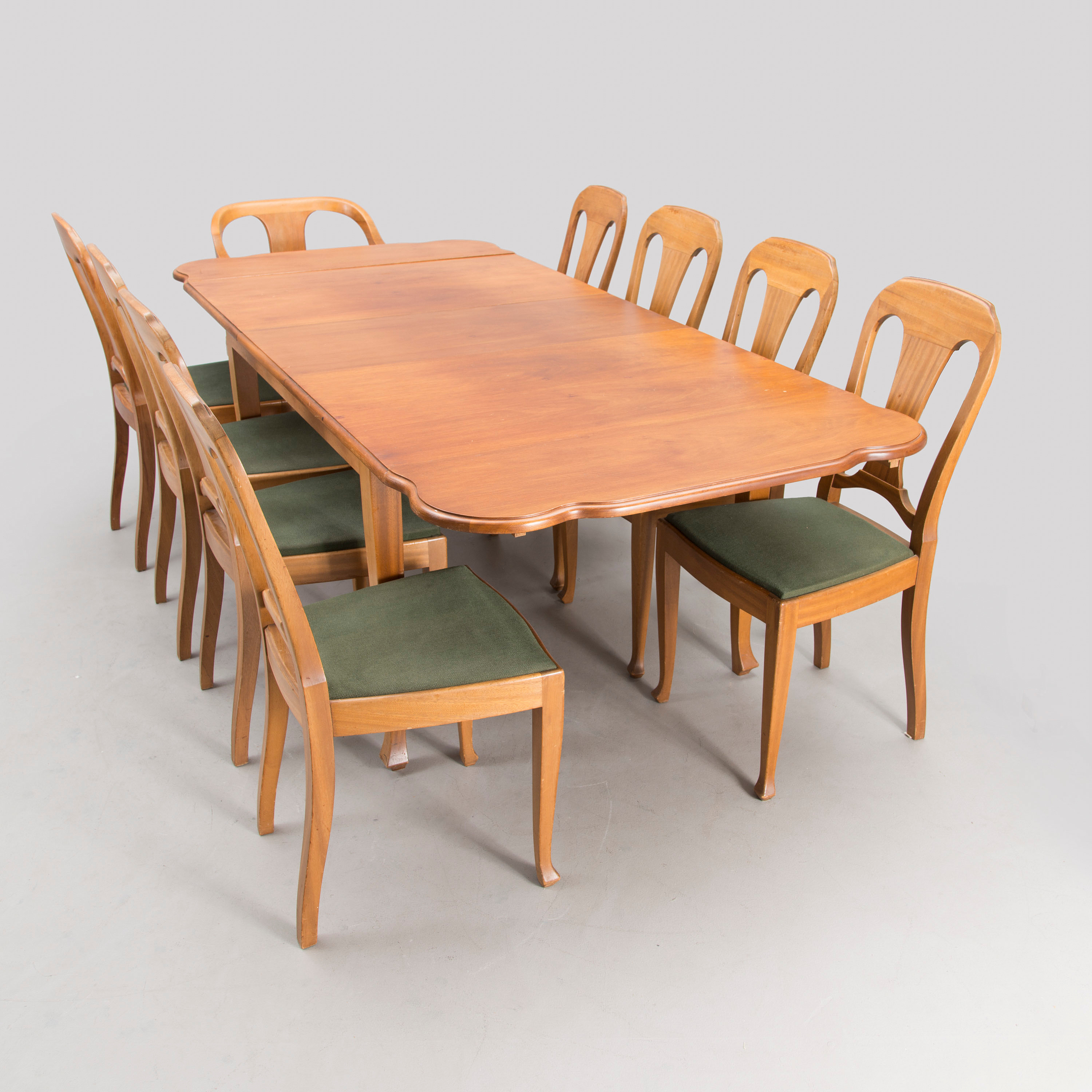 A dinner table with nine chairs, latter half of the 20th century ...