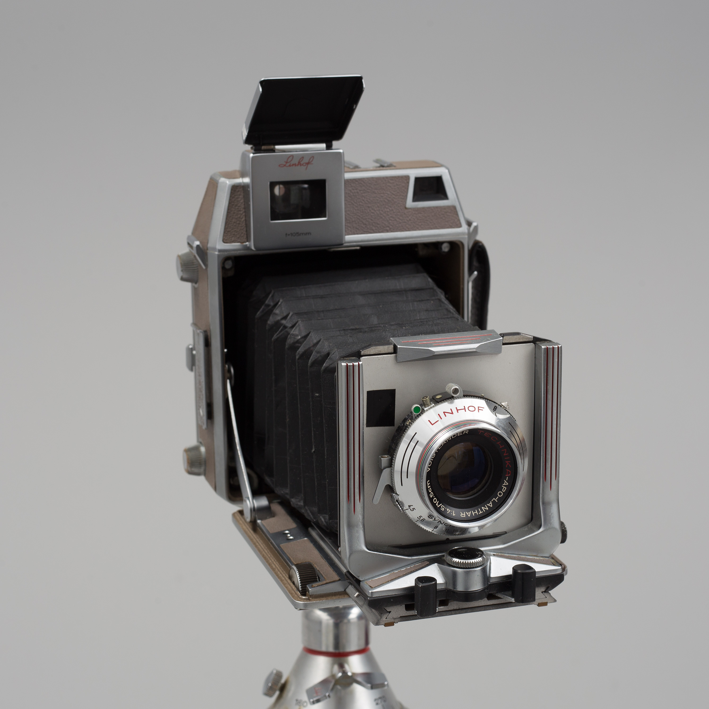 A Linhof Technika camera no 90417 with four lenses and one camera stand ...