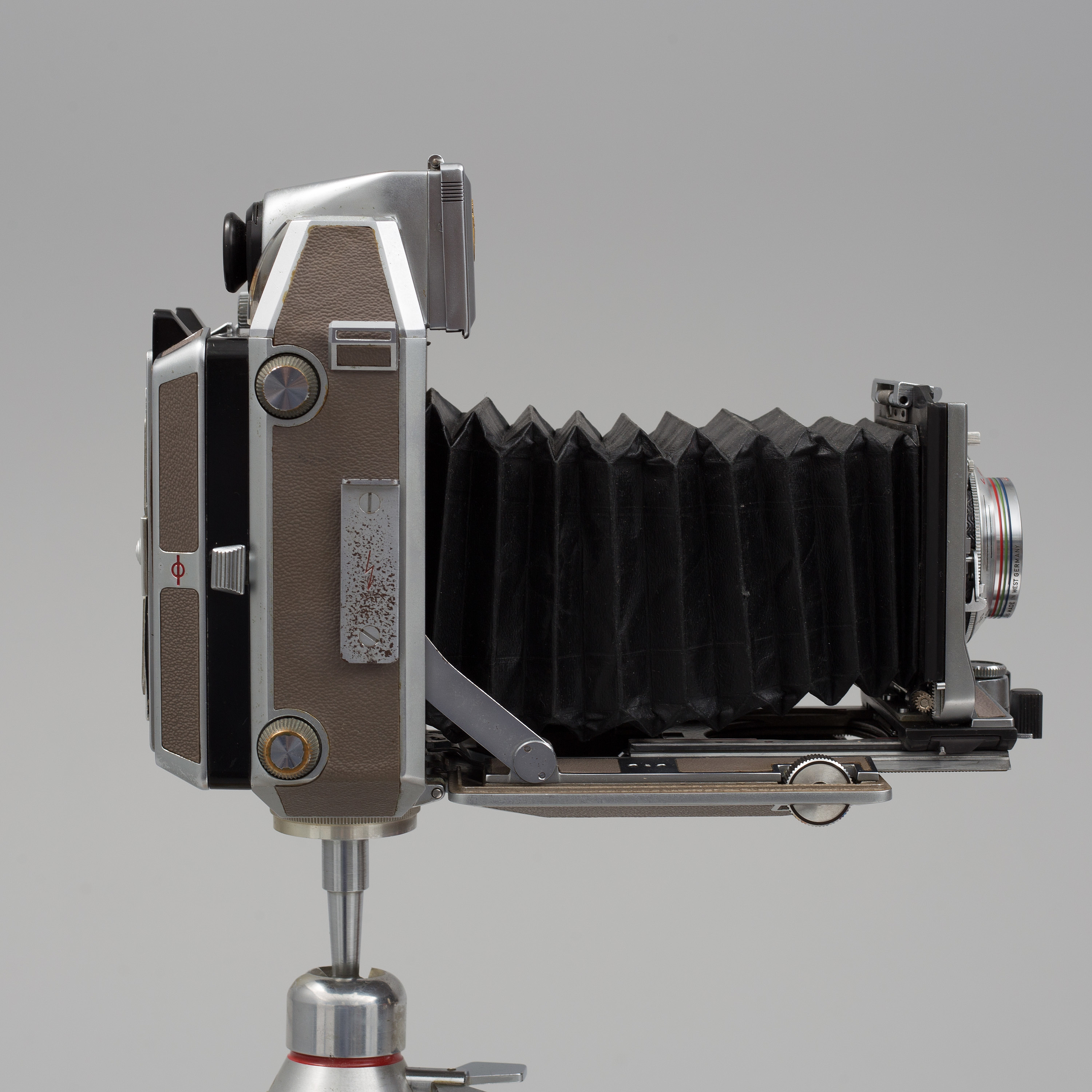 A Linhof Technika camera no 90417 with four lenses and one camera stand ...