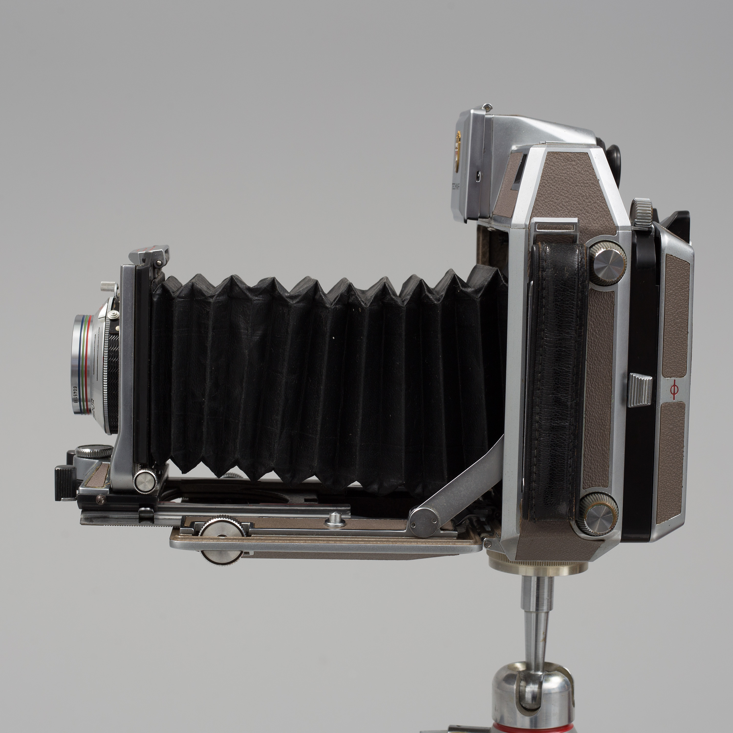 A Linhof Technika camera no 90417 with four lenses and one camera stand ...