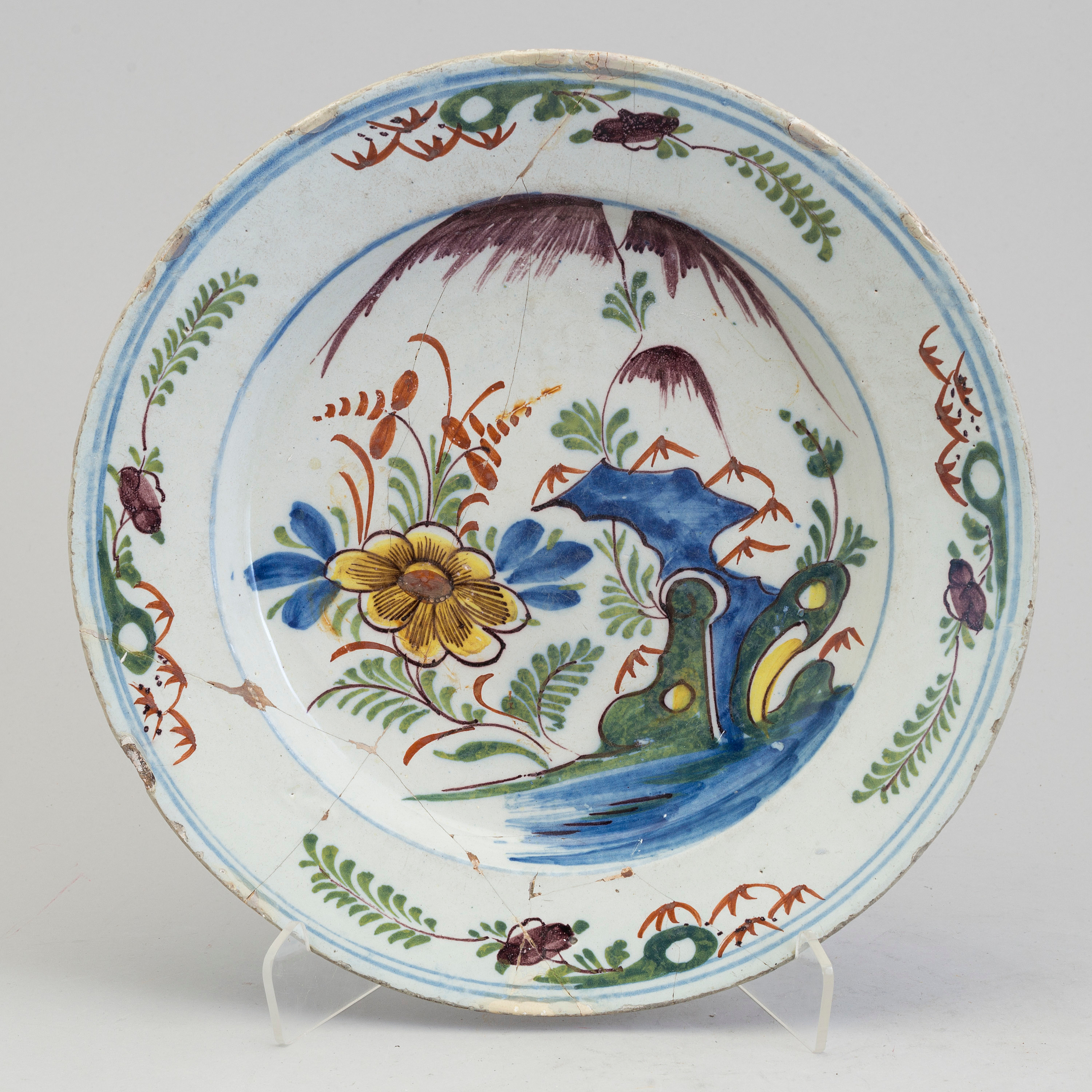 A 18th century faience plate. - Bukowskis