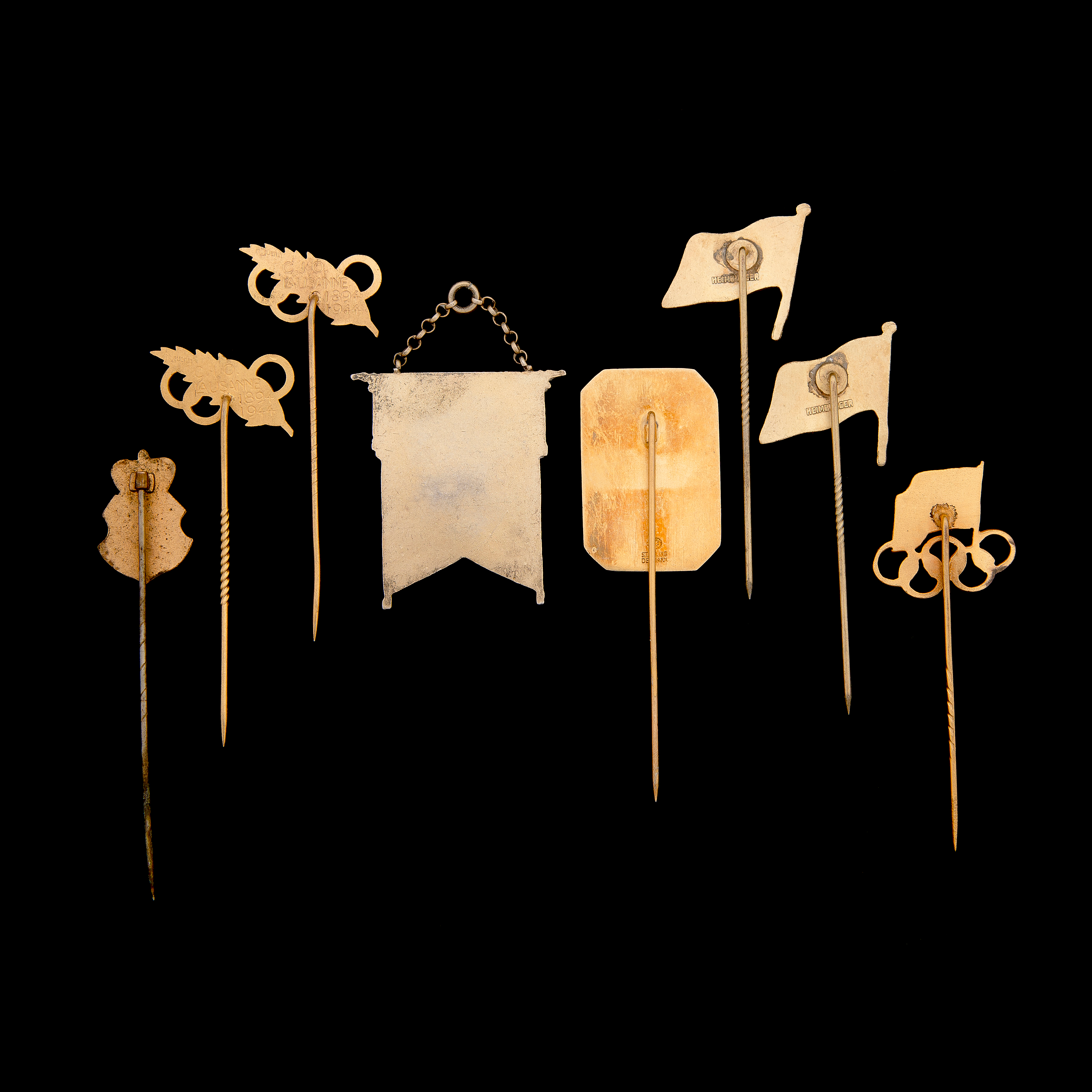 A set of late 19th Century/first half of 20th Century pins and a jetton ...