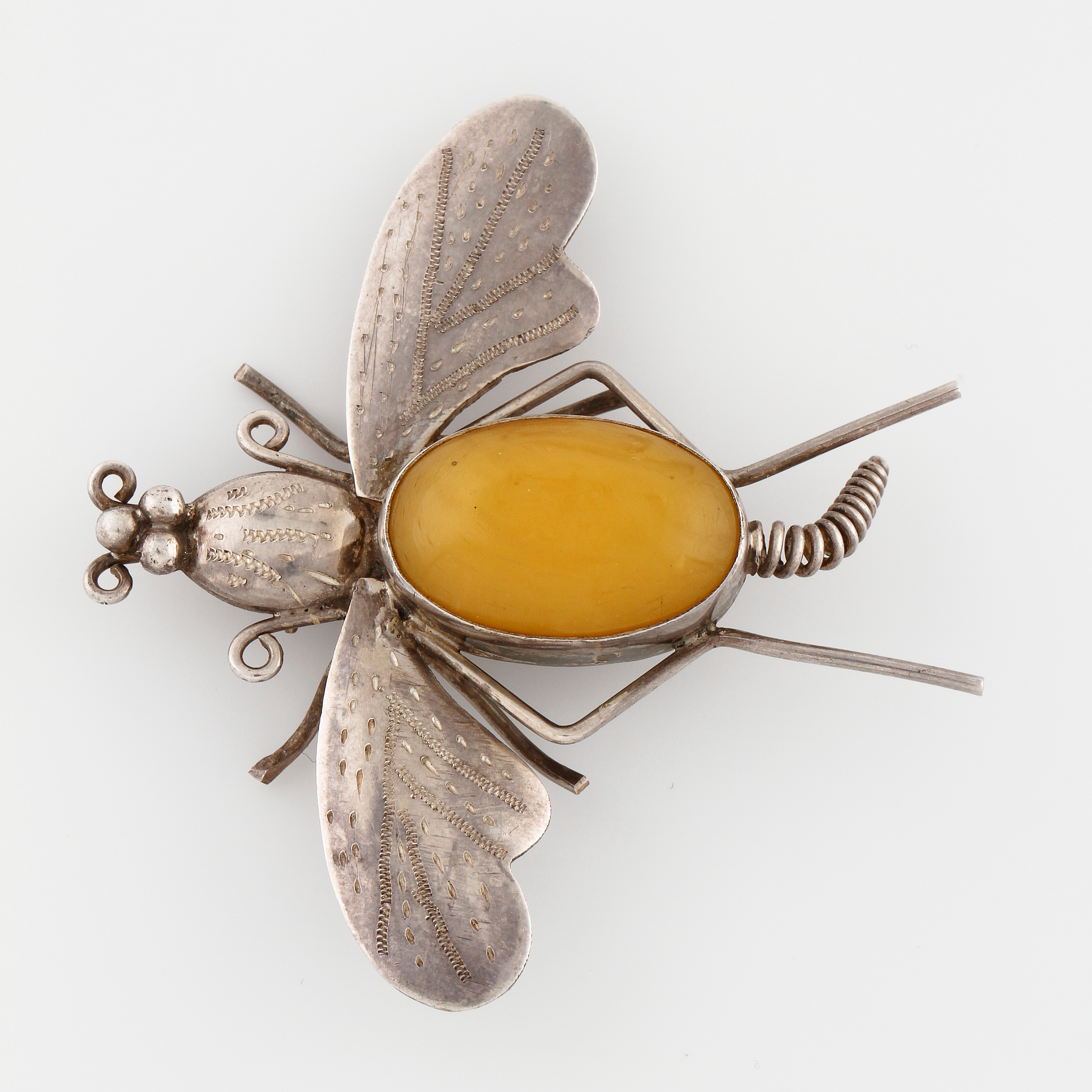 BROSCH, med cabochonslipad bärnsten. - Bukowskis