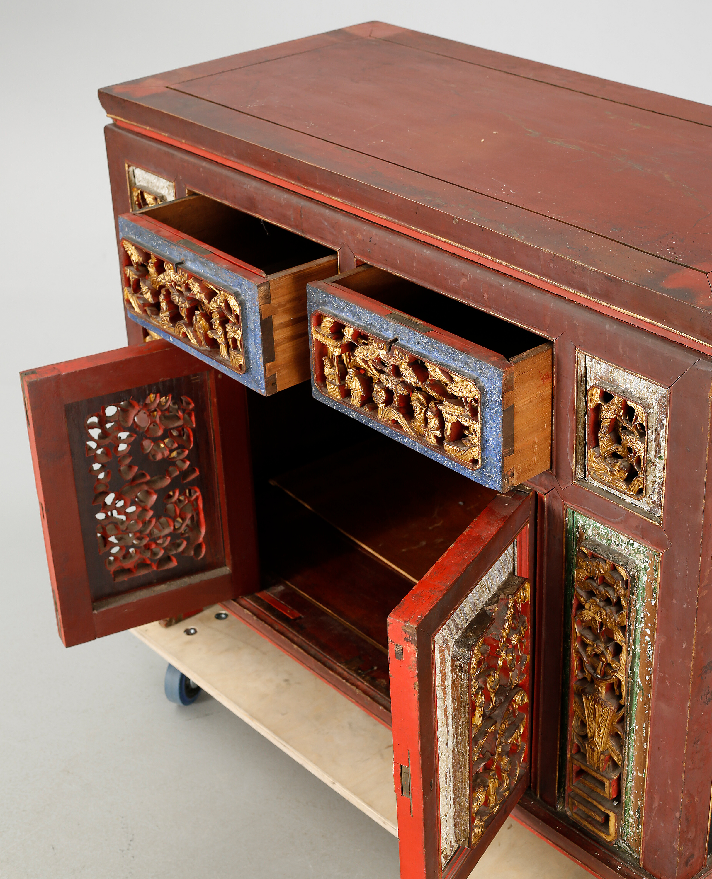 A chinese sideboard, first half of the 20th century. Older panels ...