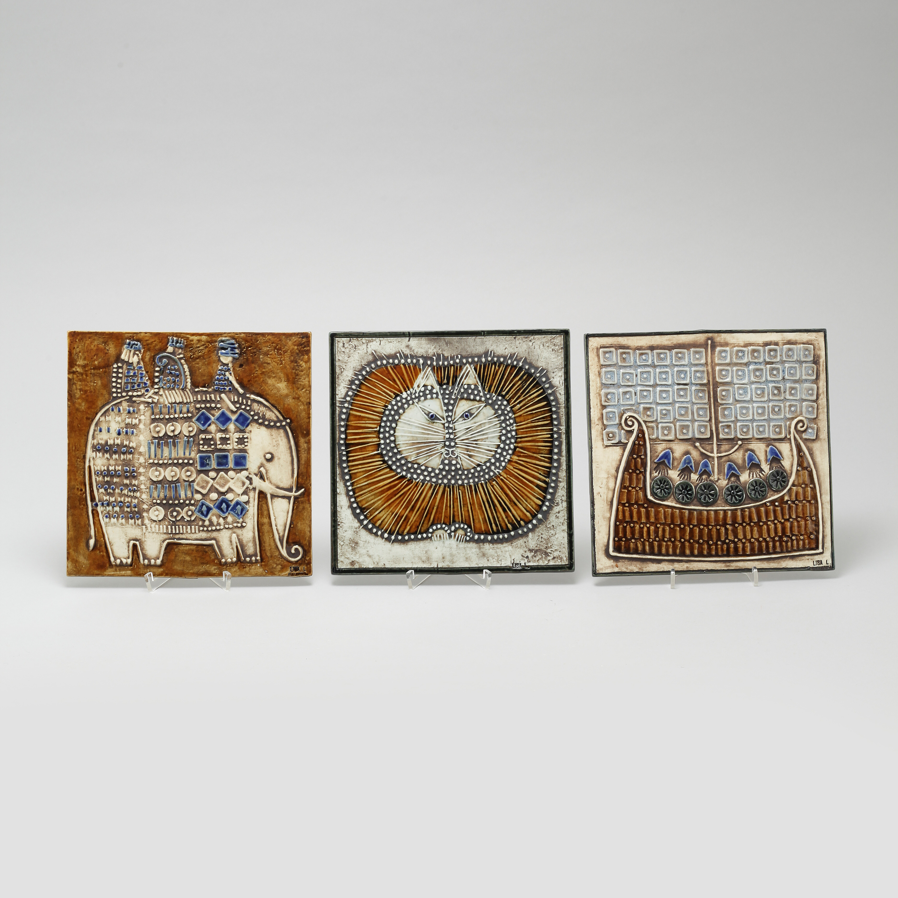 Three wall reliefs by LISA LARSON, Gustavsberg, stamp signed. - Bukowskis