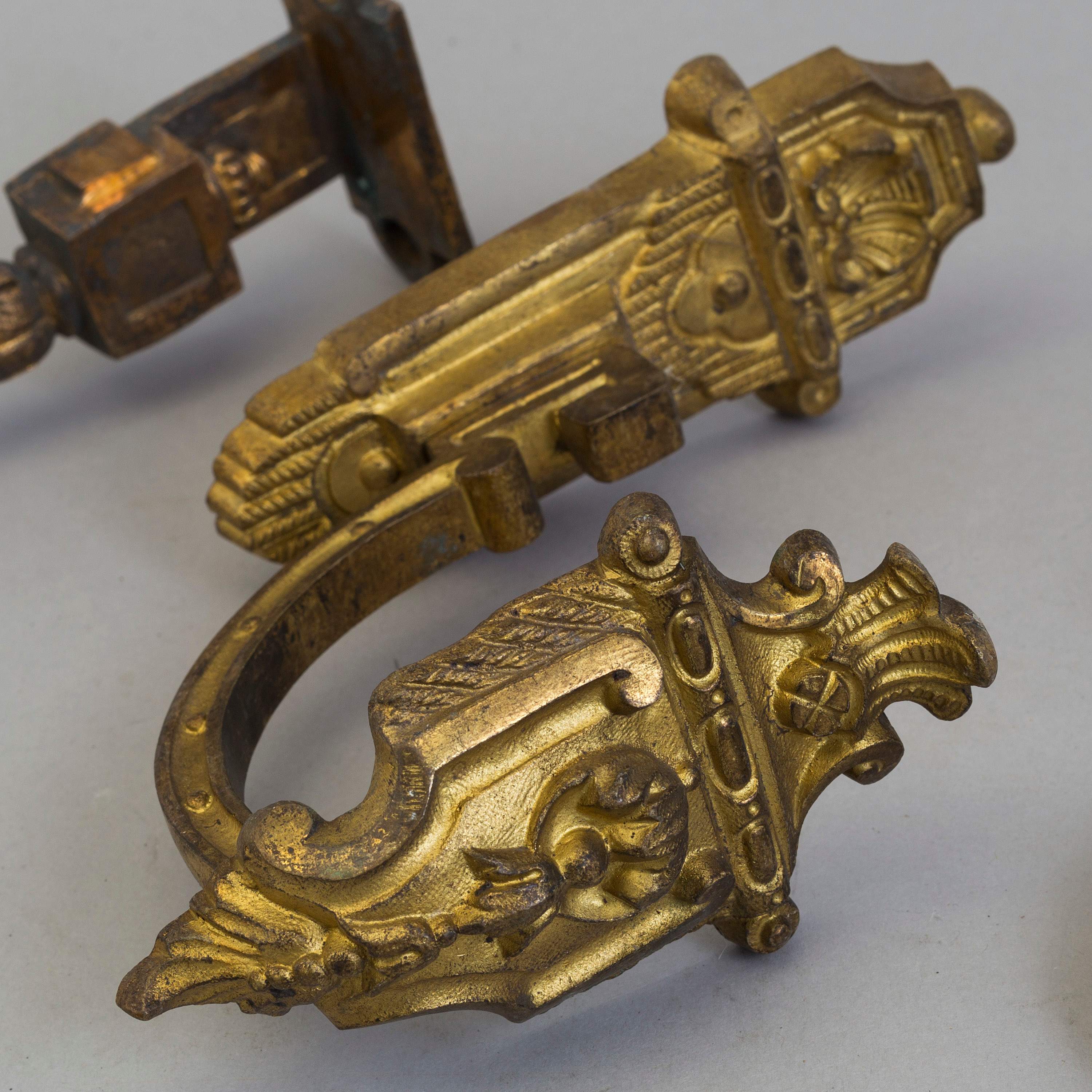 SIX DIFFERENT BRONZE CURTAIN TIE-BACKS, 19th century. - Bukowskis