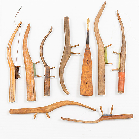 NINE WOODEN ICE FISHING RODS, ca 1900. - Bukowskis