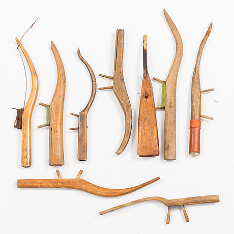 NINE WOODEN ICE FISHING RODS, ca 1900. - Bukowskis